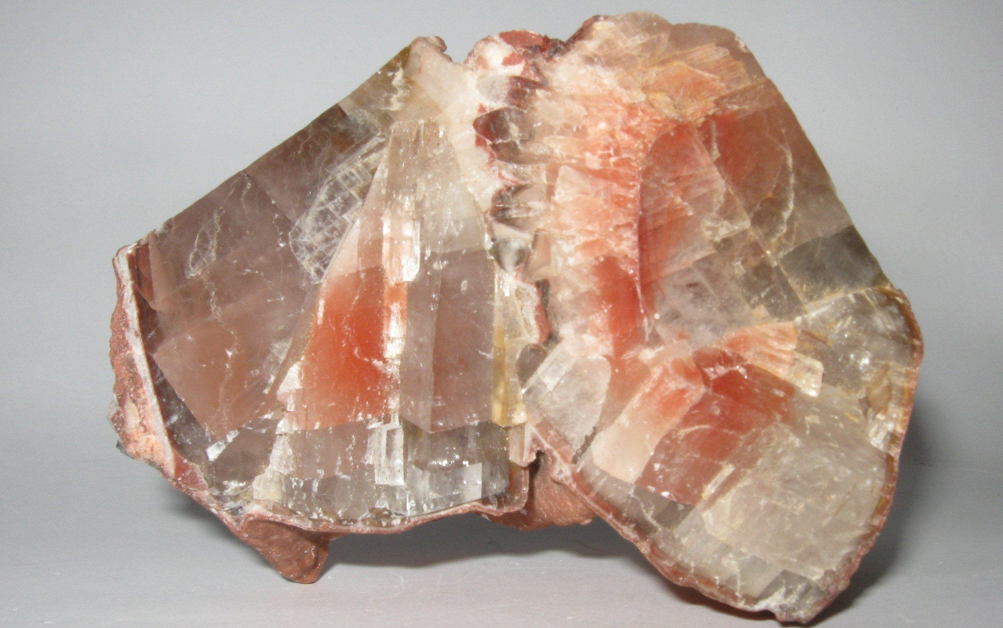 Calcite Scalenohedrons coated with Red Hematite | – Of Coins & Crystals